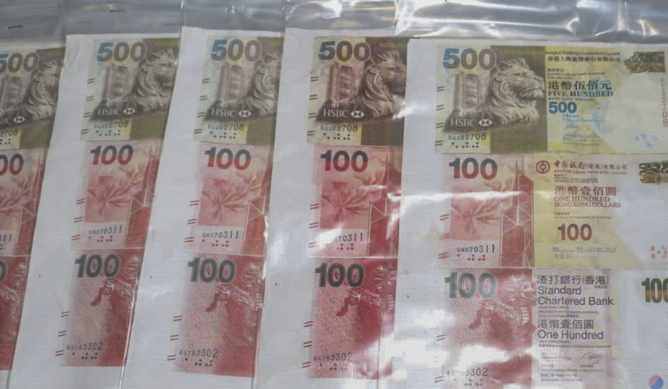 Hong Kong police seize HK$9,100 in bogus bills during raid on ...
